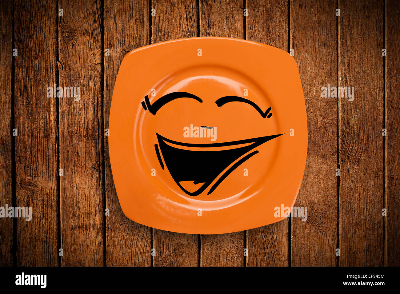 Happy smiley cartoon face on colorful dish plate Stock Photo - Alamy