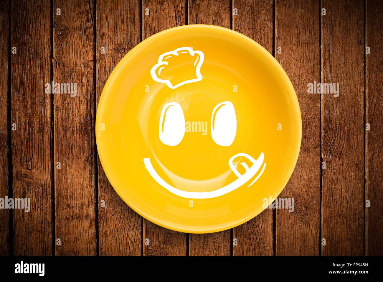 Happy smiley cartoon face on colorful dish plate Stock Photo - Alamy