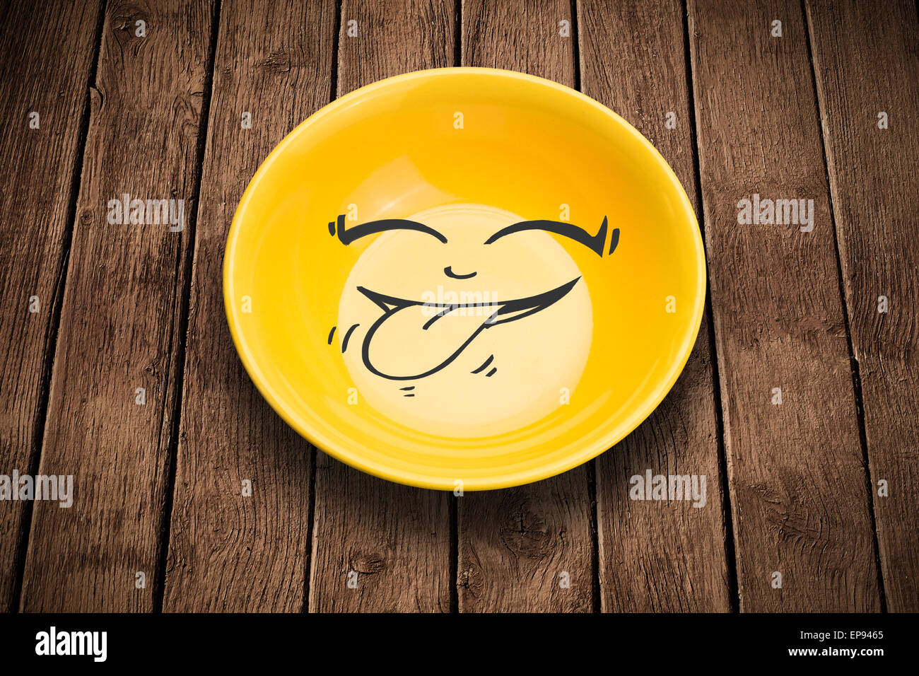 Happy smiley cartoon face on colorful dish plate Stock Photo - Alamy