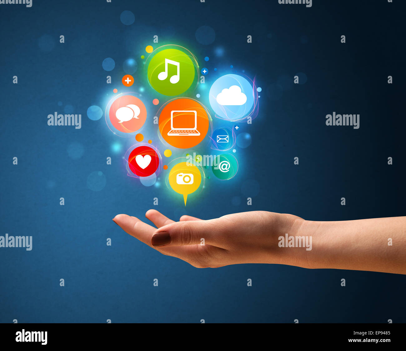 Multimedia icons in the hand of a woman Stock Photo - Alamy