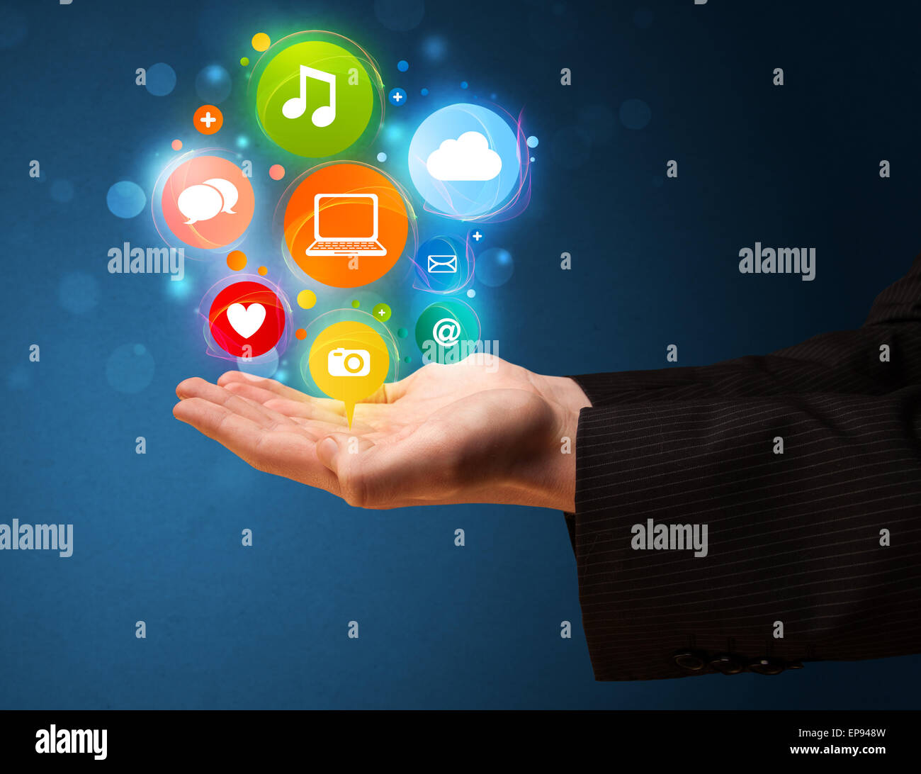 Multimedia icons in the hand of a businessman Stock Photo - Alamy