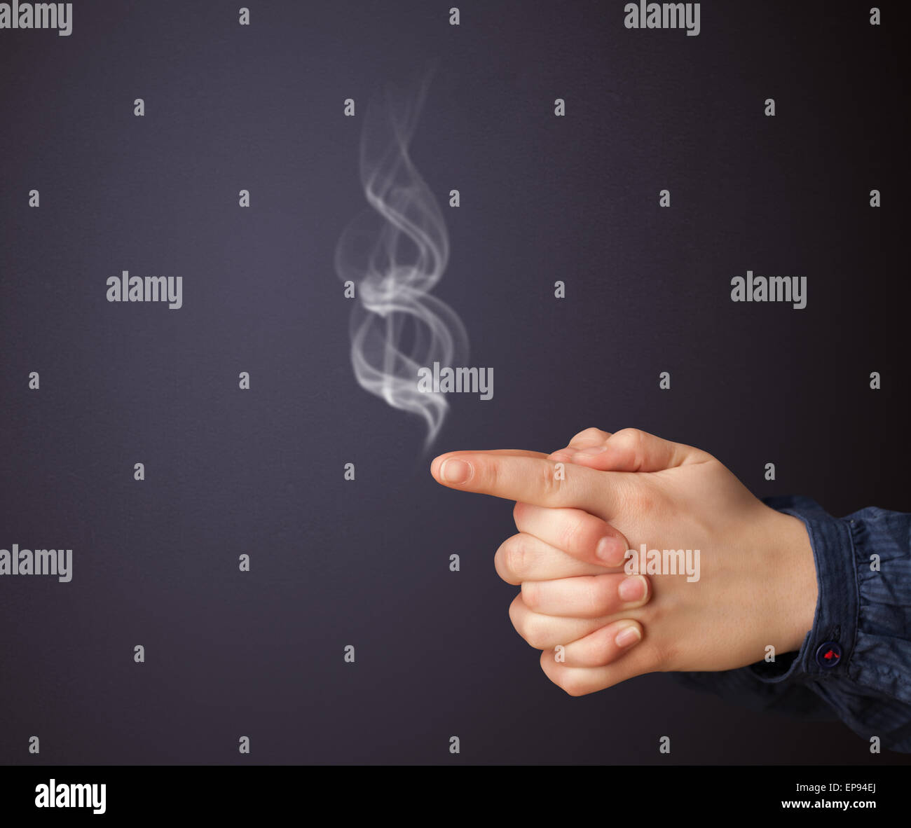 Gun shaped woman hand Stock Photo - Alamy