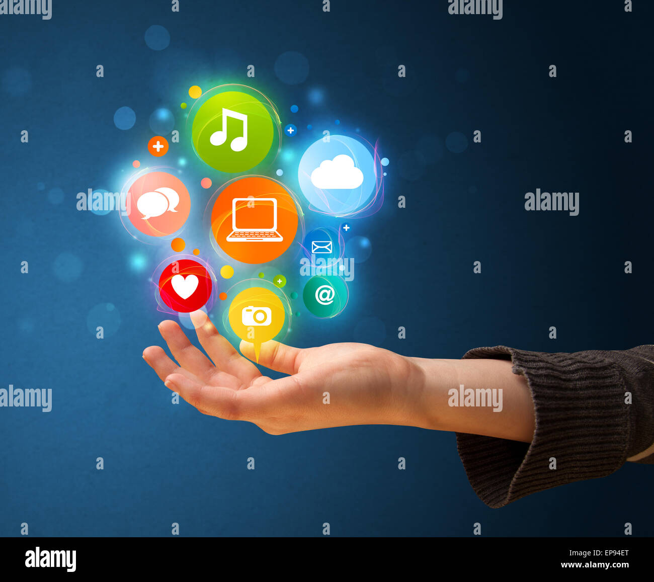 Multimedia icons in the hand of a woman Stock Photo - Alamy