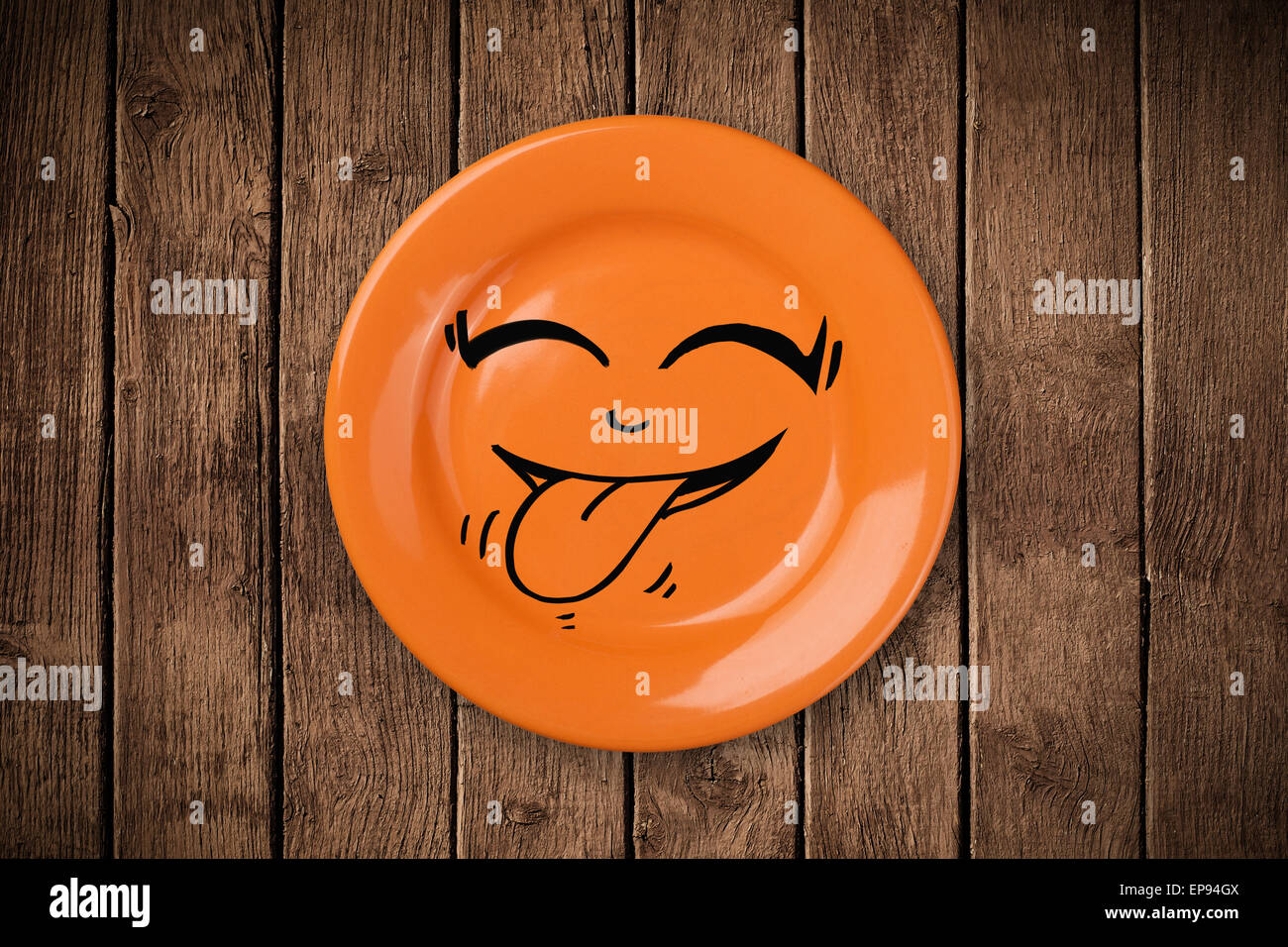 Happy smiley cartoon face on colorful dish plate Stock Photo - Alamy