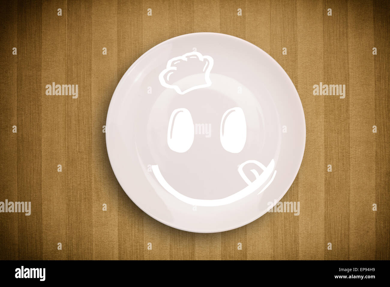 Happy smiley cartoon face on colorful dish plate Stock Photo - Alamy