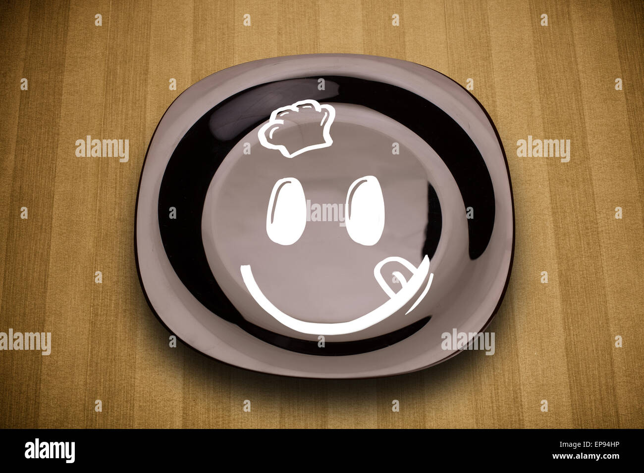 Happy smiley cartoon face on colorful dish plate Stock Photo - Alamy