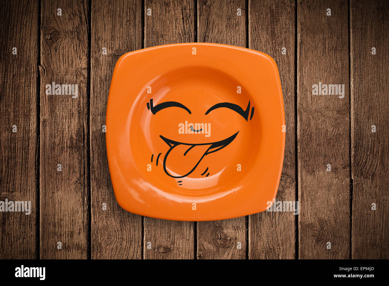 Happy smiley cartoon face on colorful dish plate Stock Photo - Alamy