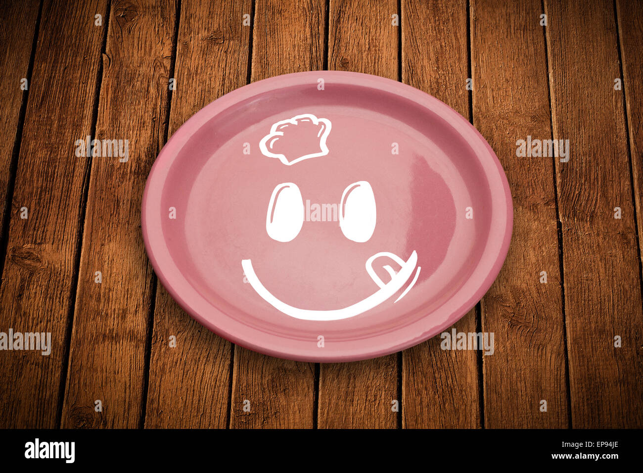 Happy smiley cartoon face on colorful dish plate Stock Photo - Alamy