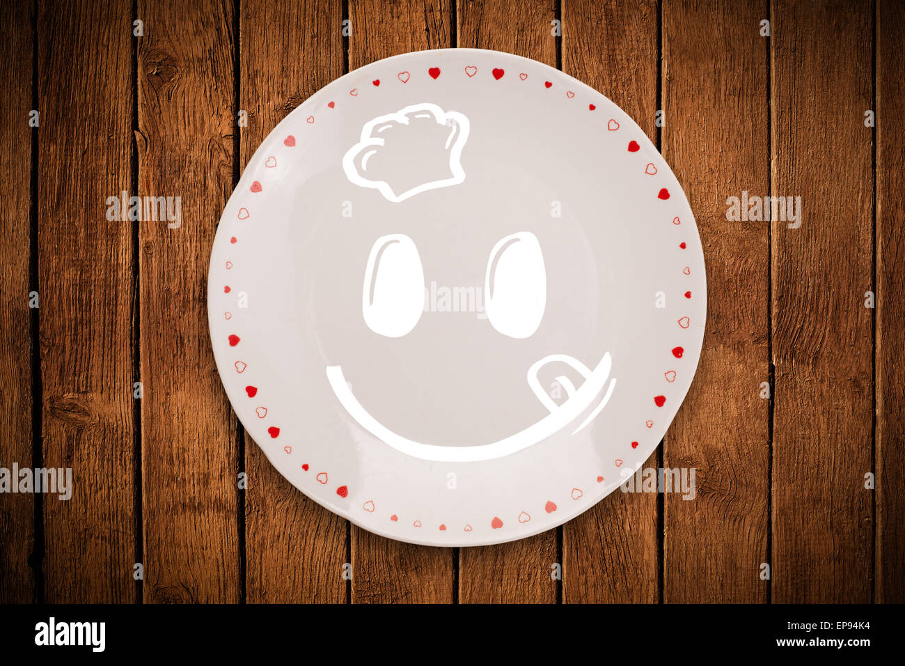 Happy smiley cartoon face on colorful dish plate Stock Photo - Alamy