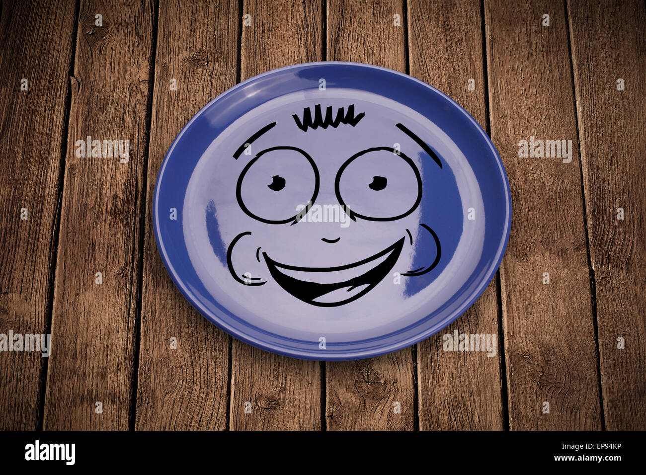 Happy smiley cartoon face on colorful dish plate Stock Photo - Alamy