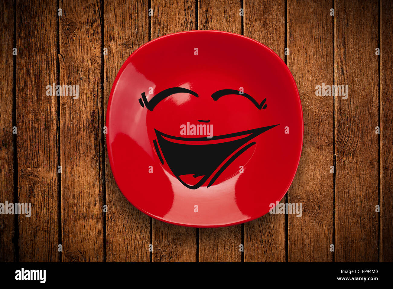 Happy smiley cartoon face on colorful dish plate Stock Photo - Alamy