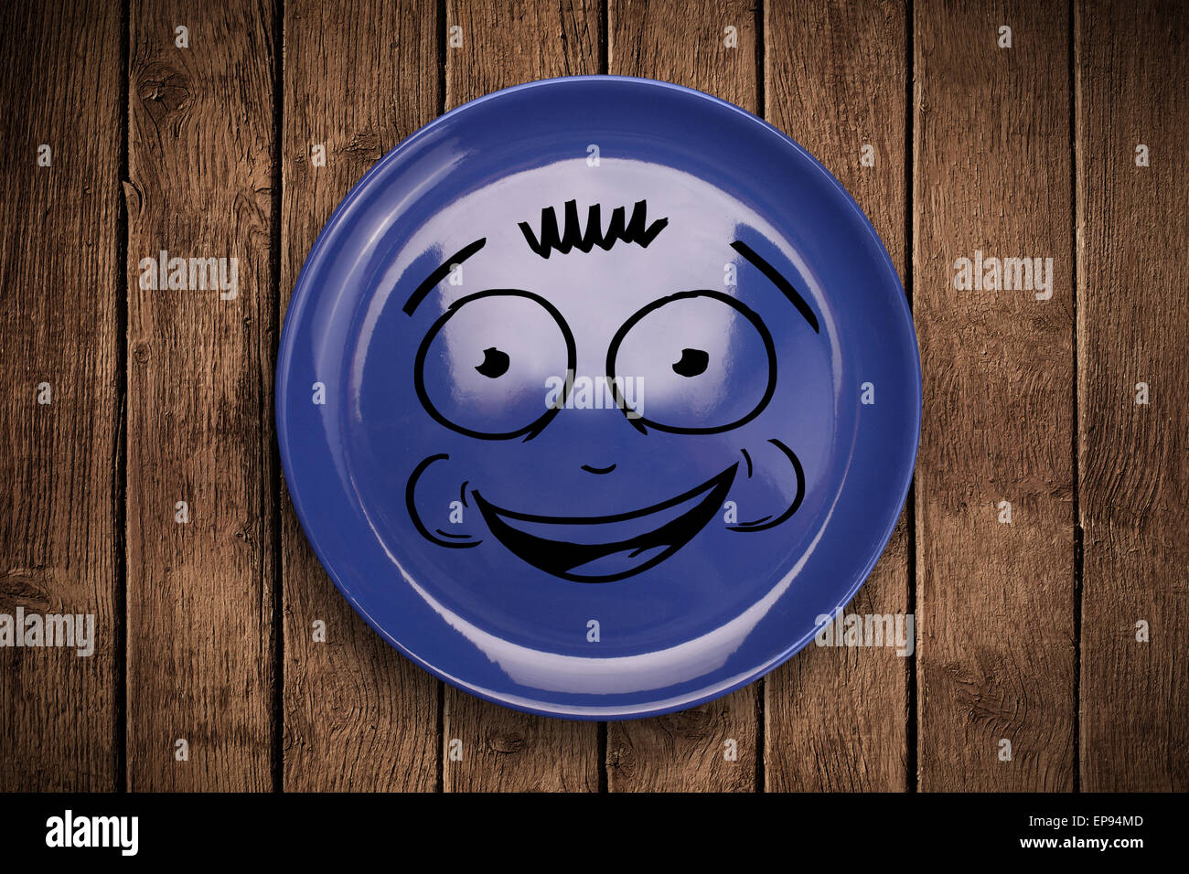 Happy smiley cartoon face on colorful dish plate Stock Photo - Alamy