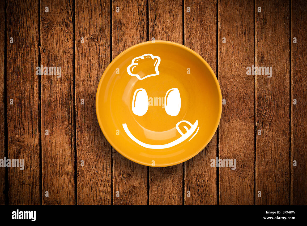 Happy smiley cartoon face on colorful dish plate Stock Photo - Alamy