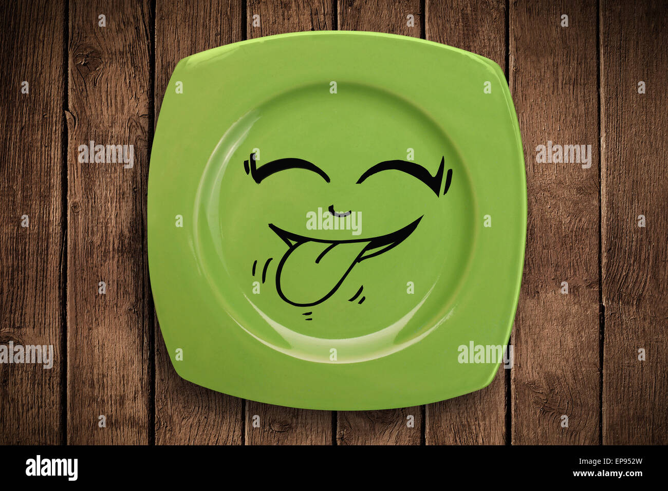 Happy smiley cartoon face on colorful dish plate Stock Photo - Alamy