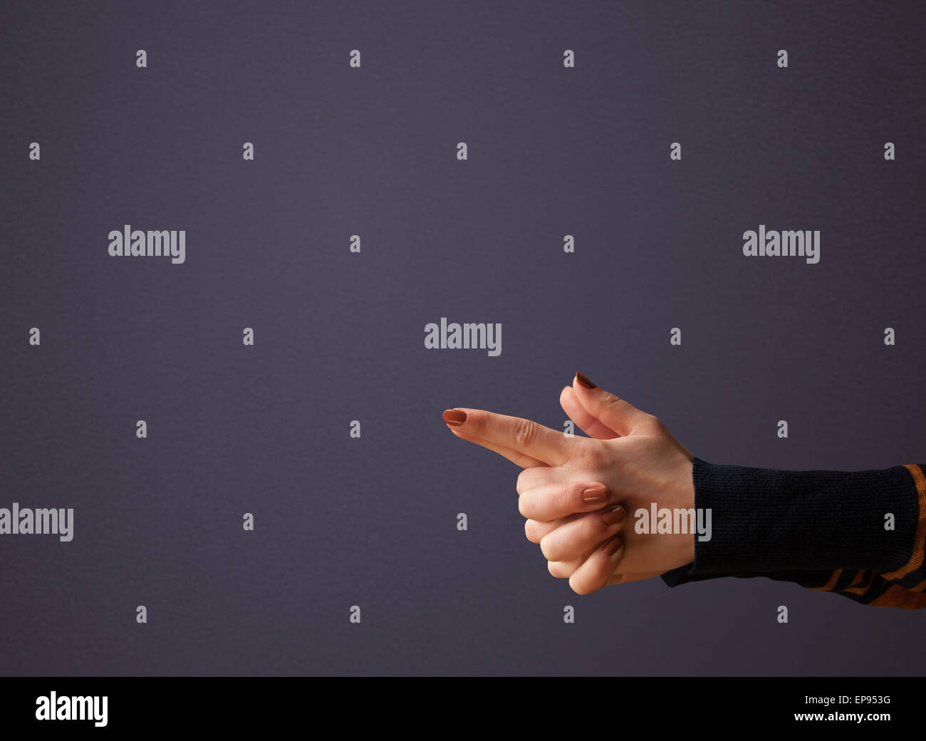 Gun shaped woman hand Stock Photo - Alamy