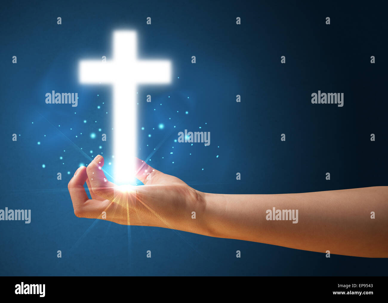Glowing cross in the hand of a woman Stock Photo - Alamy