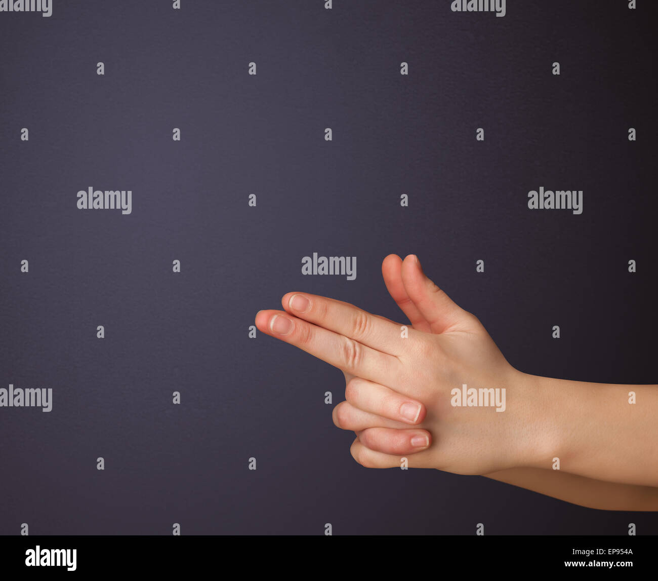 Gun shaped woman hand Stock Photo - Alamy