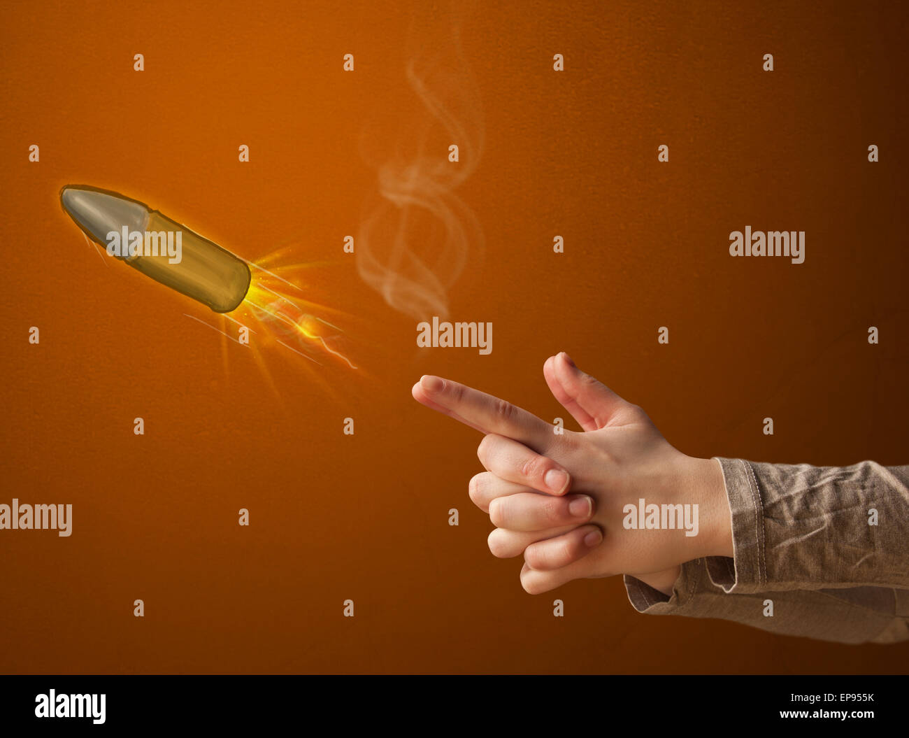 Gun shaped woman hand with bullet Stock Photo - Alamy
