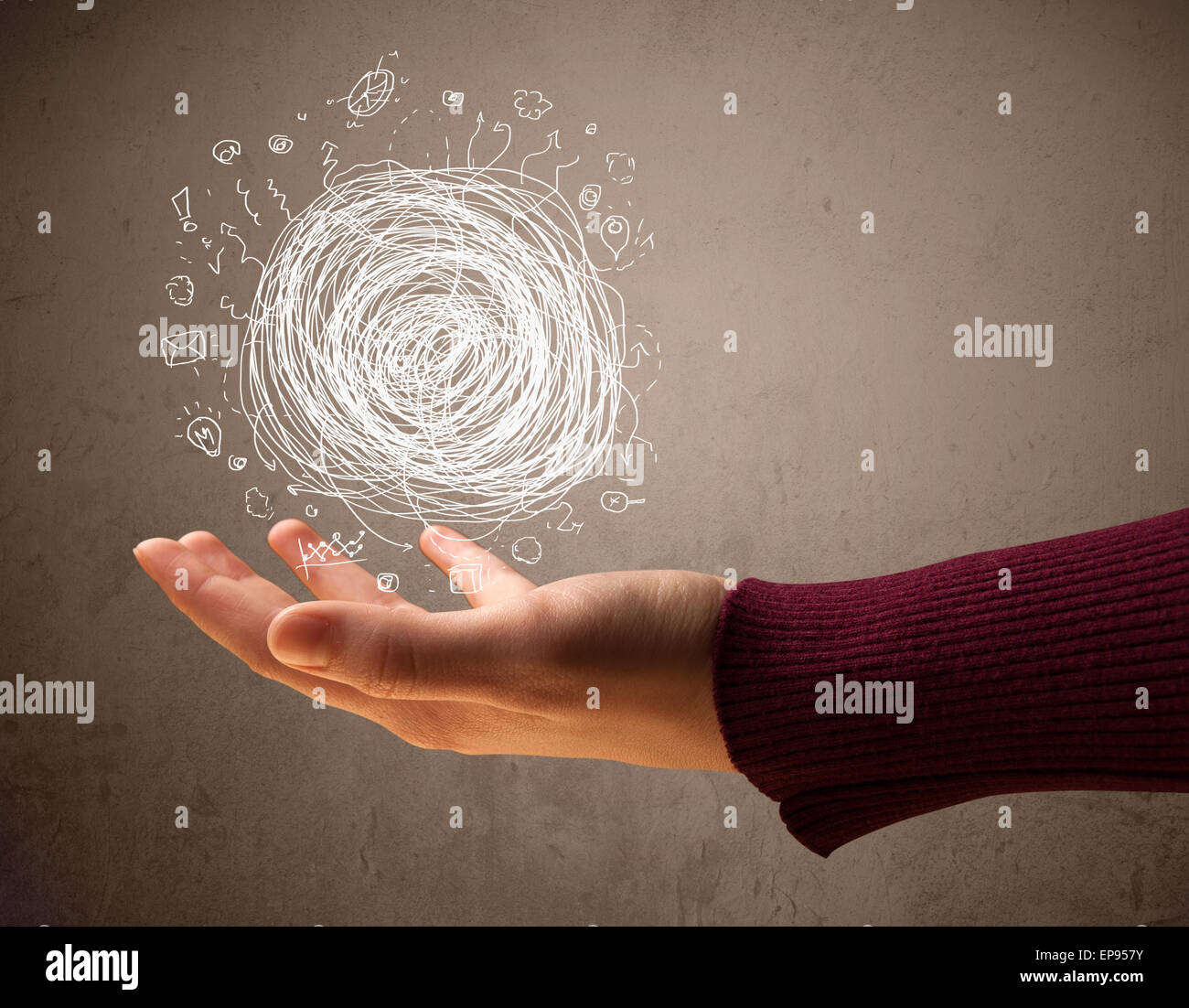 Chaos concept in the hand of a woman Stock Photo - Alamy