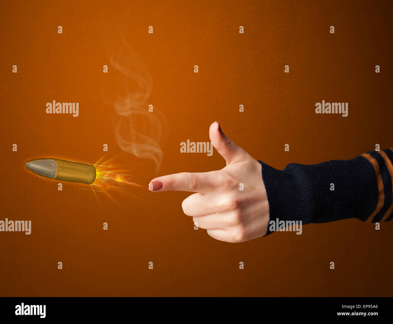 Gun shaped woman hand with bullet Stock Photo - Alamy