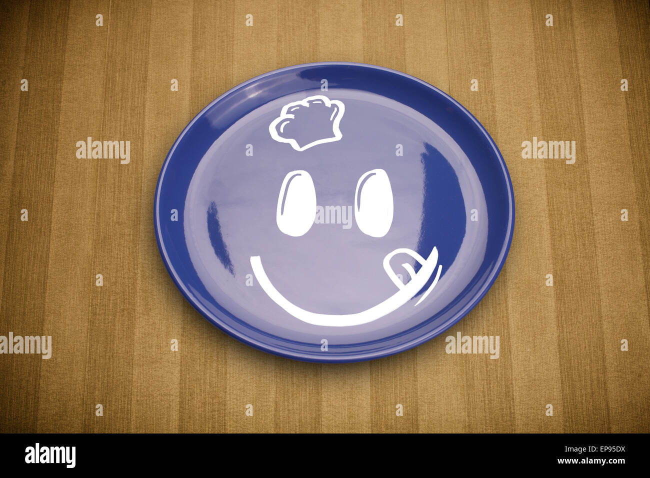 Happy smiley cartoon face on colorful dish plate Stock Photo - Alamy