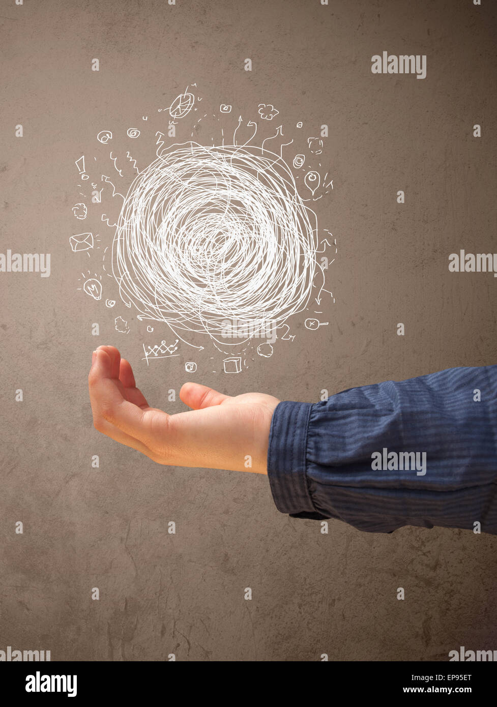 Chaos concept in the hand of a woman Stock Photo - Alamy