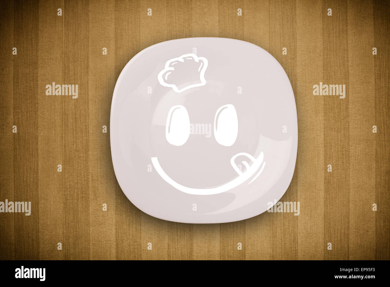 Happy smiley cartoon face on colorful dish plate Stock Photo - Alamy