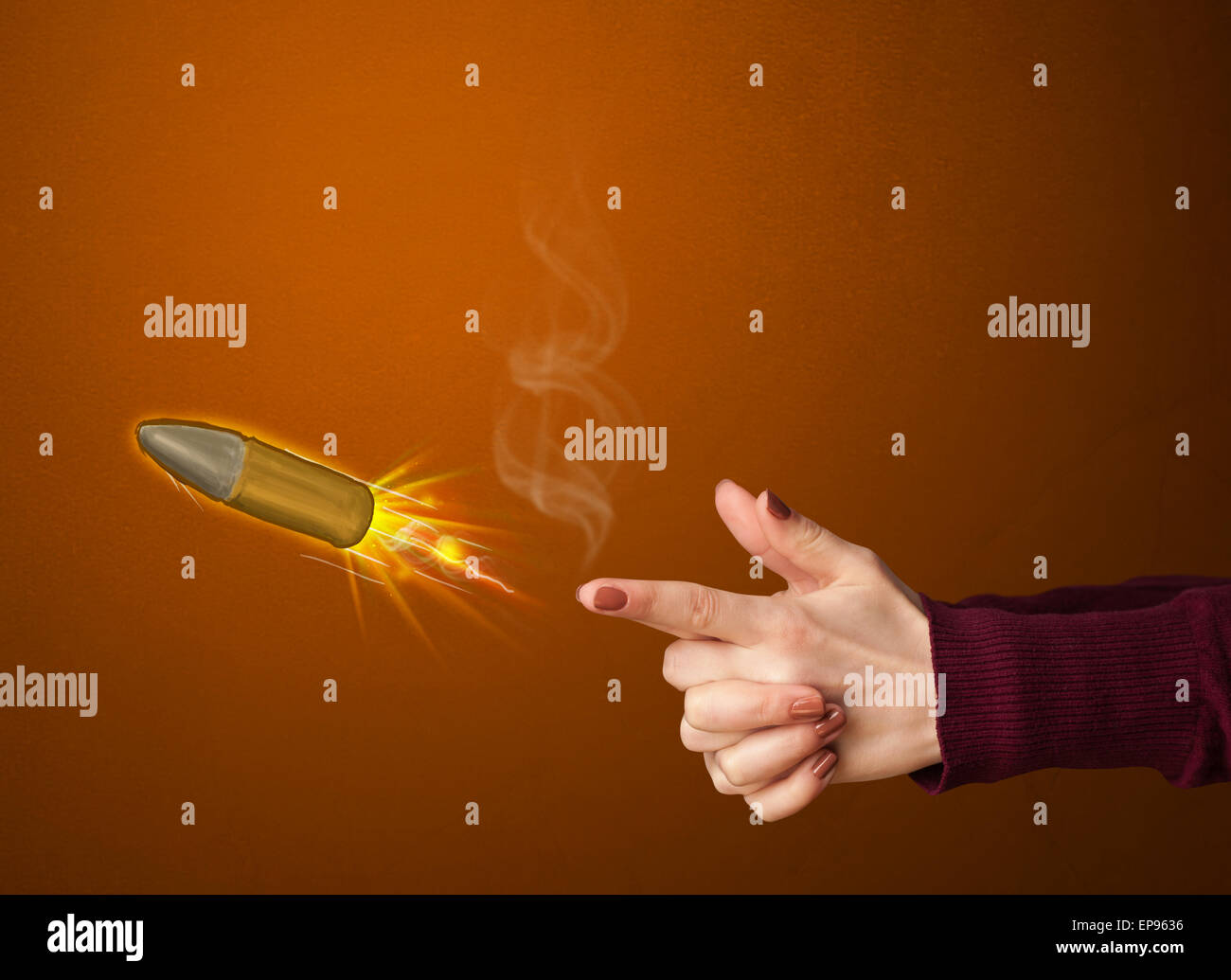 Gun shaped woman hand with bullet Stock Photo - Alamy