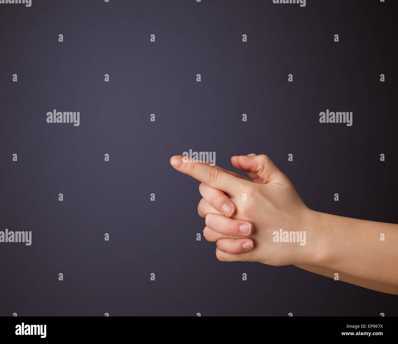 Gun shaped woman hand Stock Photo - Alamy