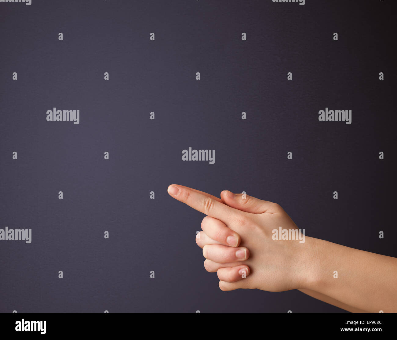 Gun shaped woman hand Stock Photo - Alamy