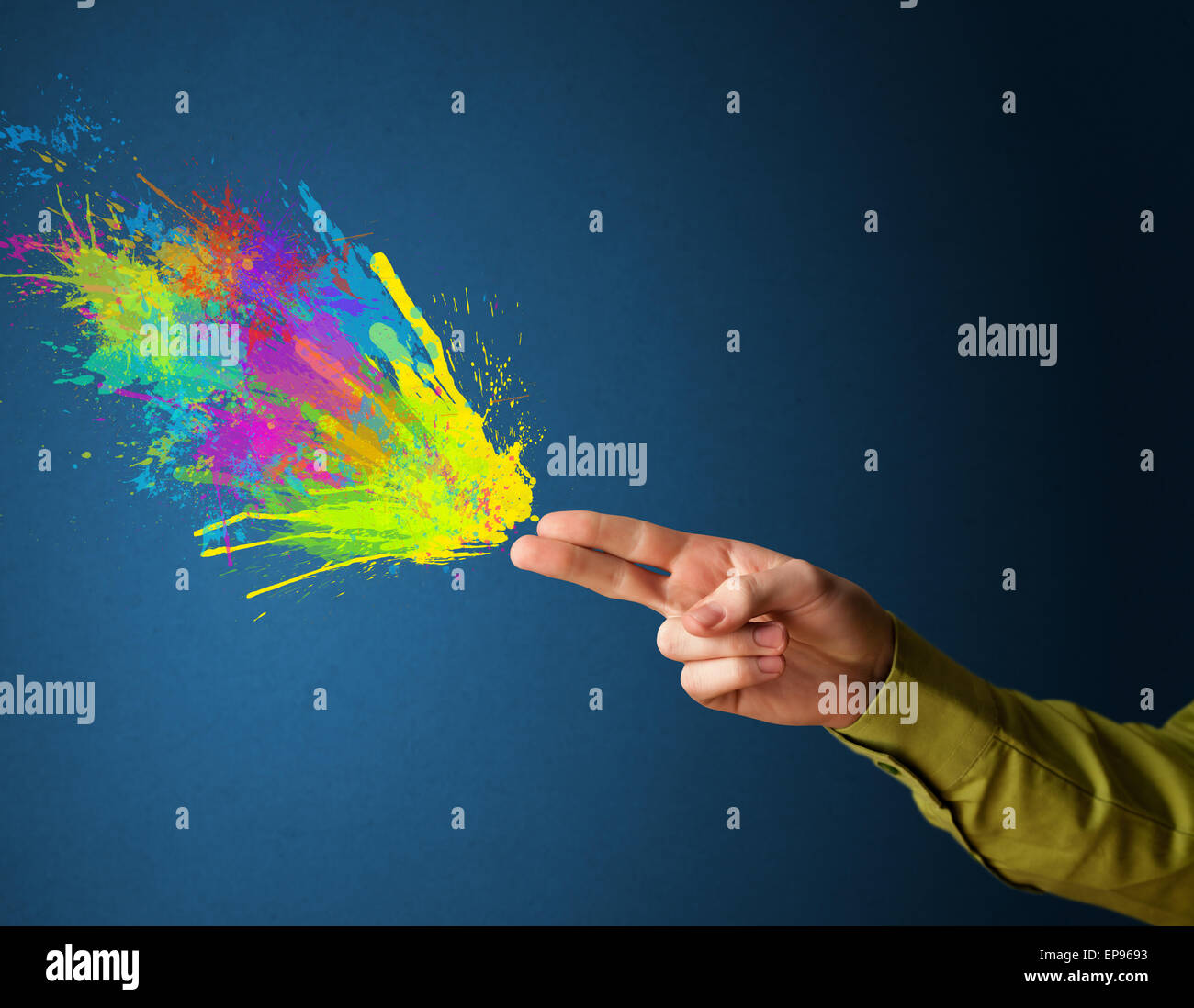 Colorful splashes are coming out of gun shaped hands Stock Photo - Alamy
