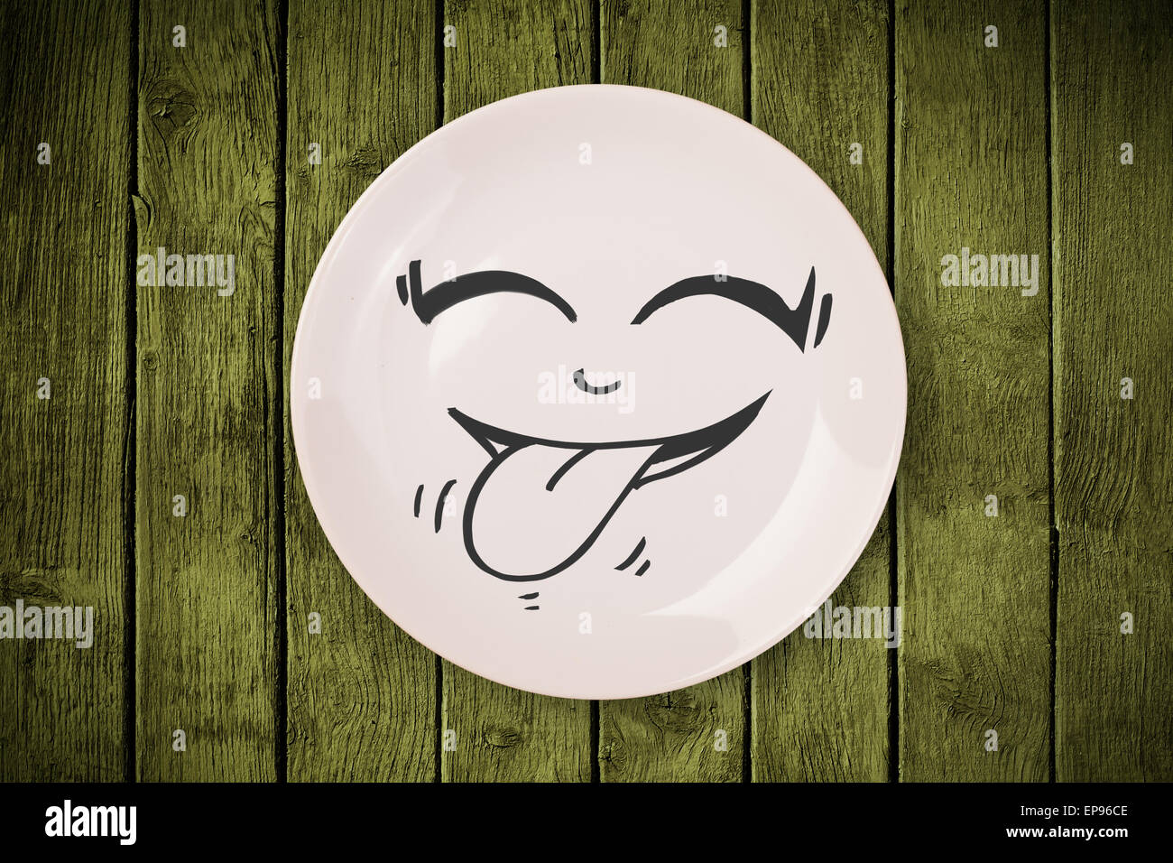 Happy smiley cartoon face on colorful dish plate Stock Photo - Alamy