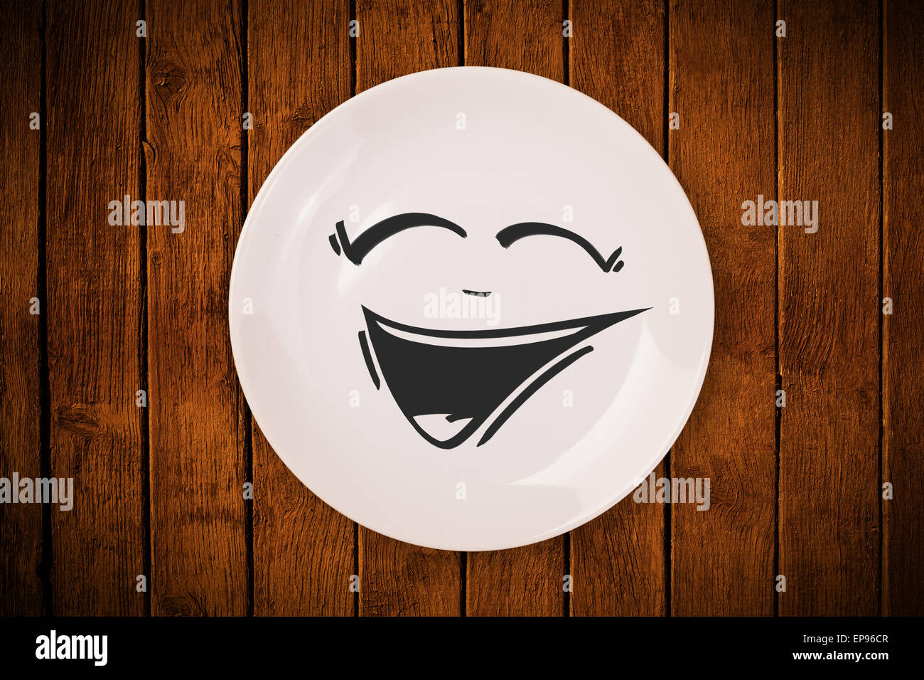 Happy smiley cartoon face on colorful dish plate Stock Photo - Alamy