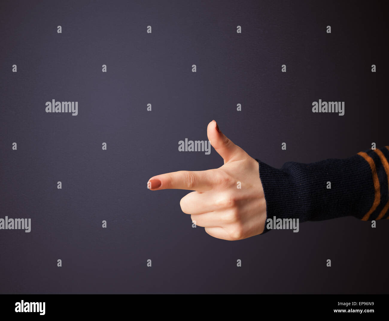 Gun shaped woman hand Stock Photo - Alamy