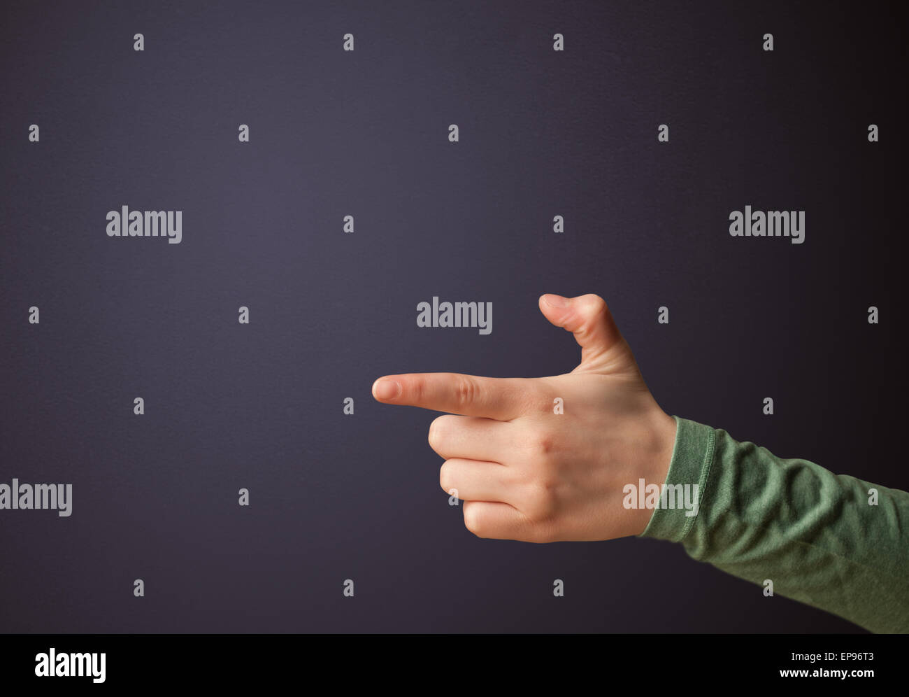 Gun shaped woman hand Stock Photo - Alamy