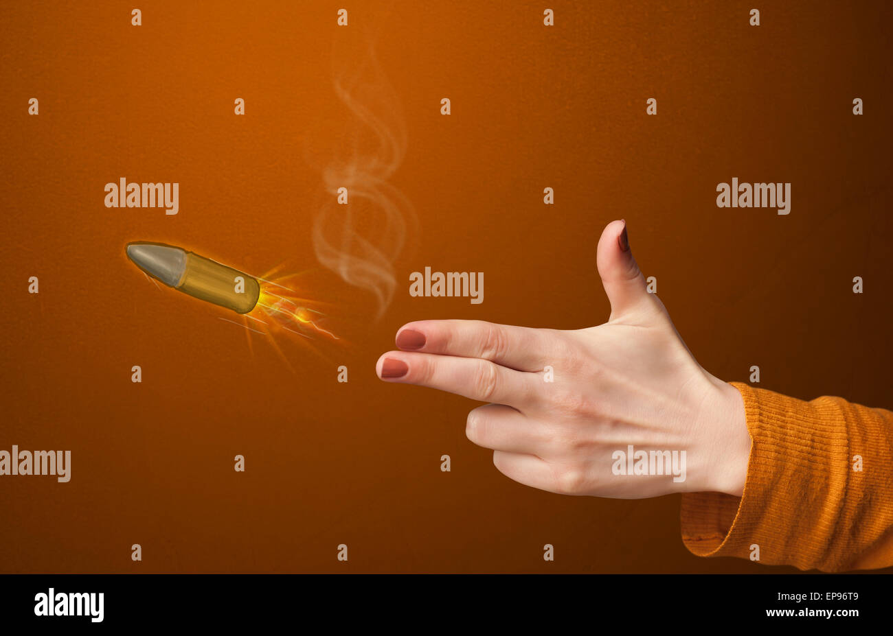 Gun shaped woman hand with bullet Stock Photo - Alamy
