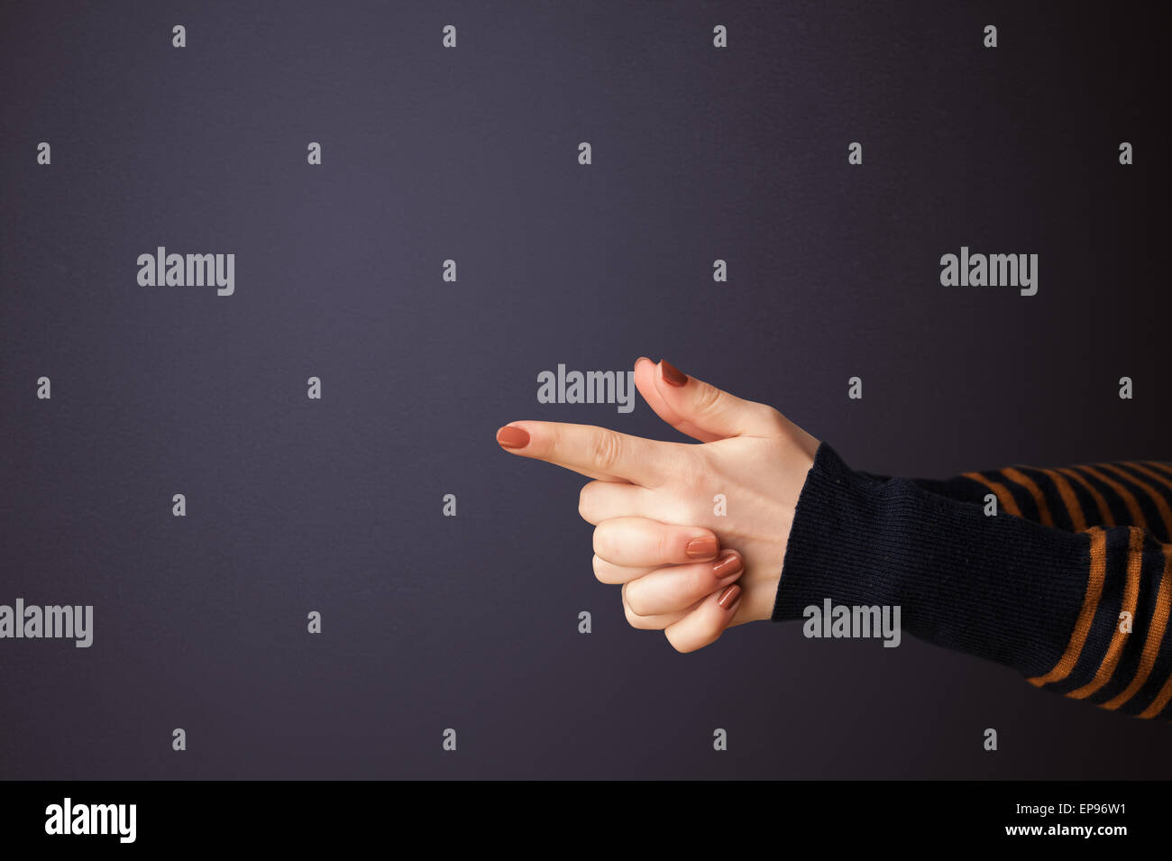 Gun shaped woman hand Stock Photo - Alamy