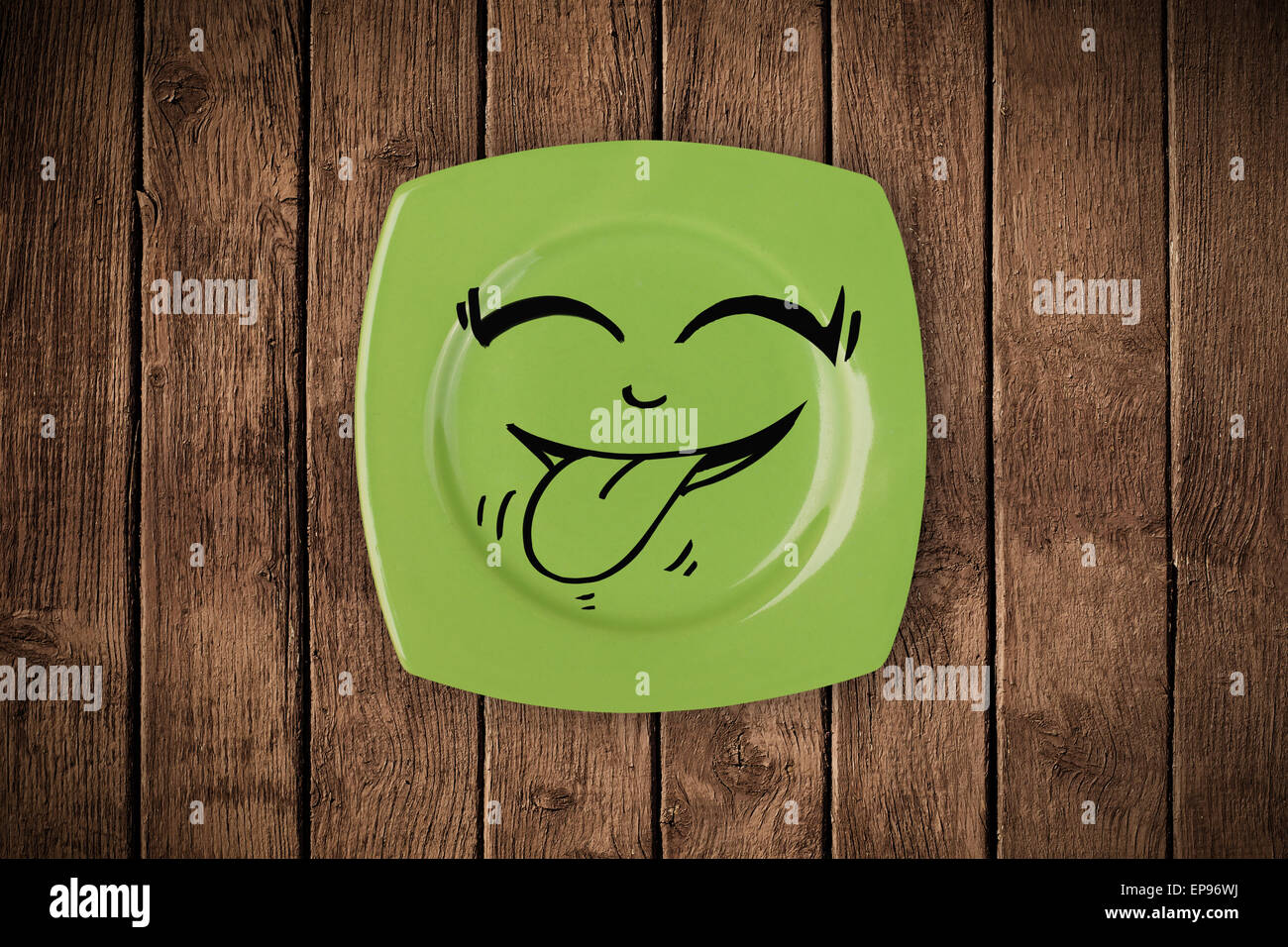 Happy smiley cartoon face on colorful dish plate Stock Photo - Alamy
