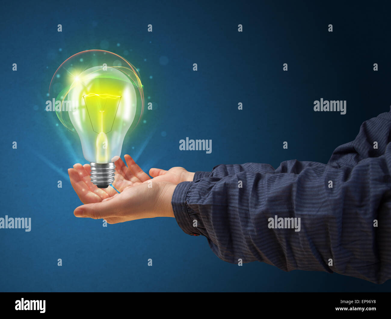 Glowing lightbulb in the hand of a woman Stock Photo - Alamy