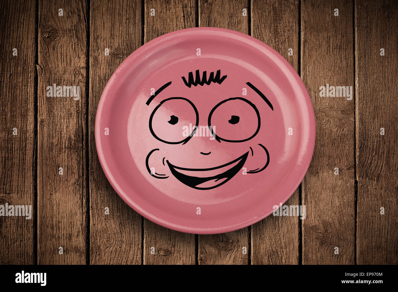 Happy smiley cartoon face on colorful dish plate Stock Photo - Alamy