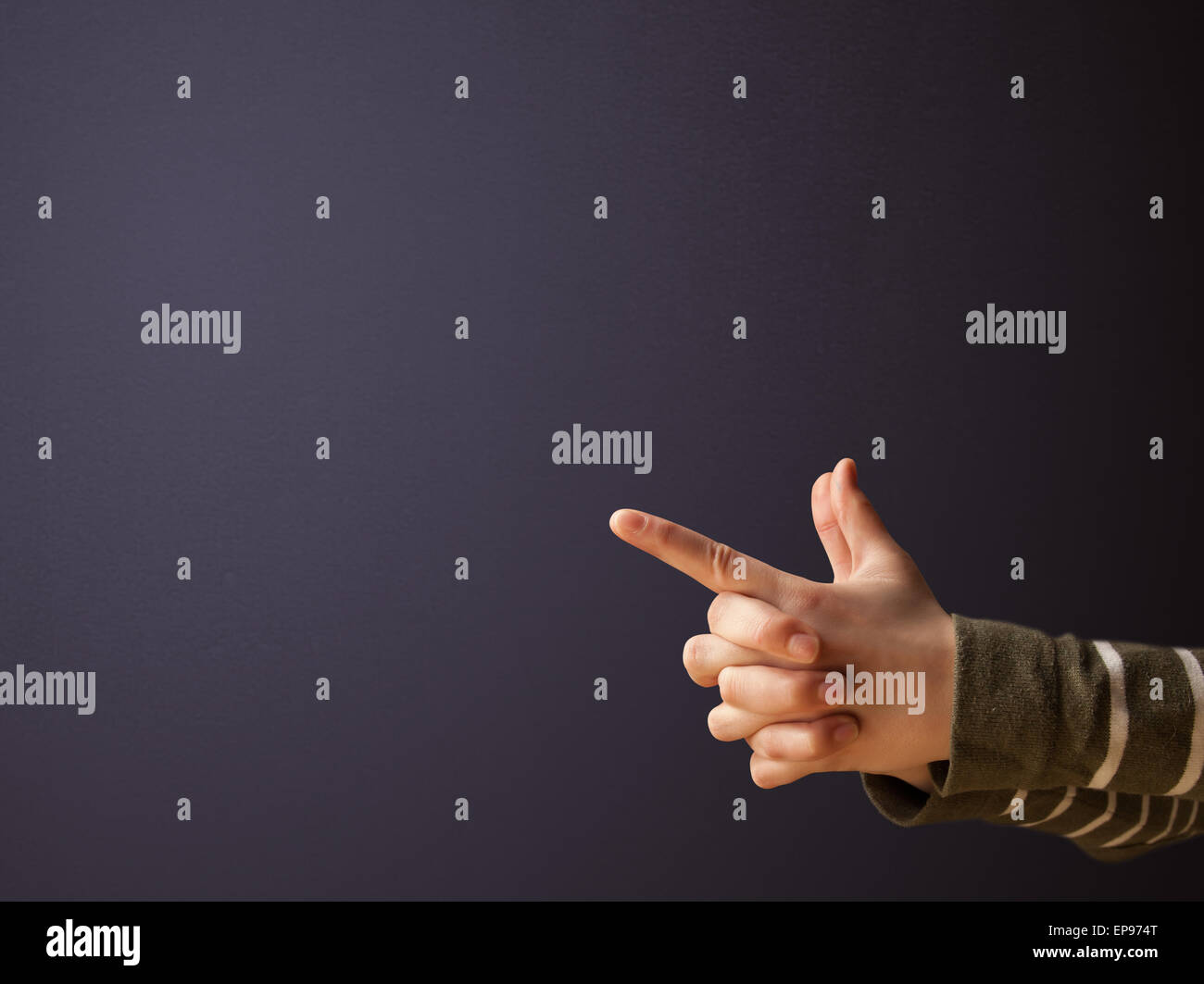 Gun shaped woman hand Stock Photo - Alamy