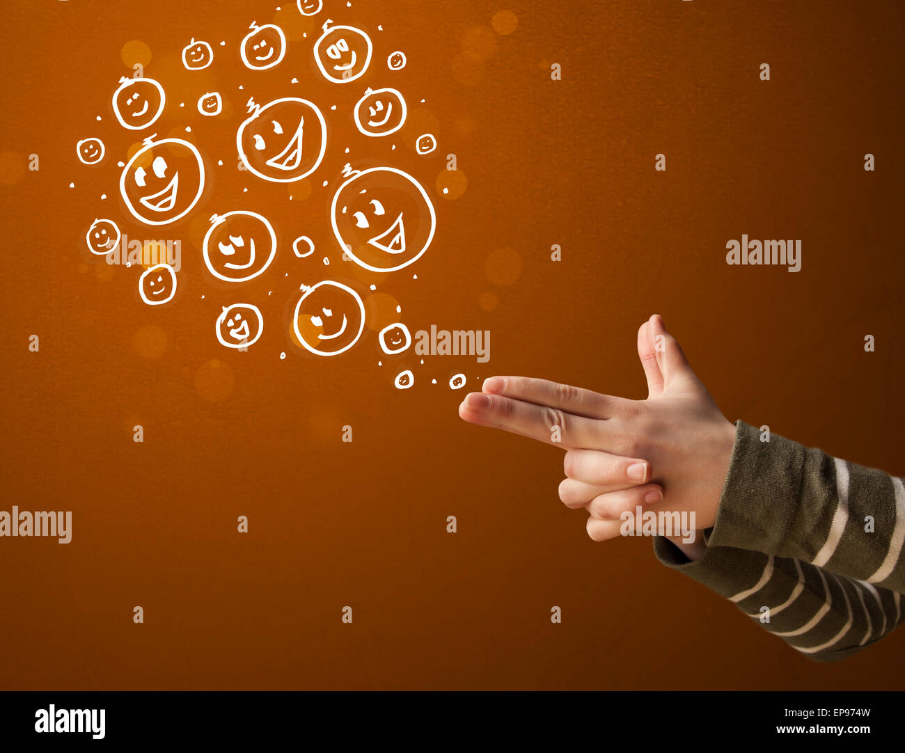 Group of happy smiley faces coming out of gun shaped hands Stock Photo ...