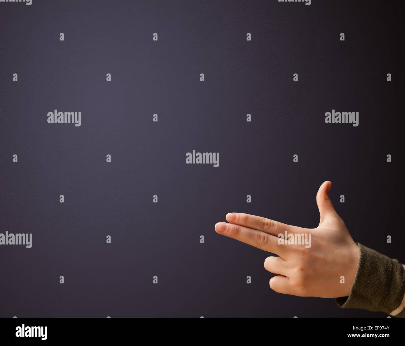 Gun shaped woman hand Stock Photo - Alamy