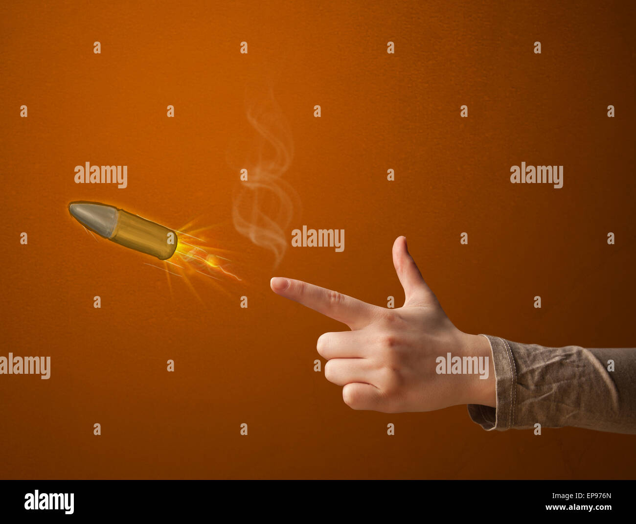 Gun shaped woman hand with bullet Stock Photo - Alamy