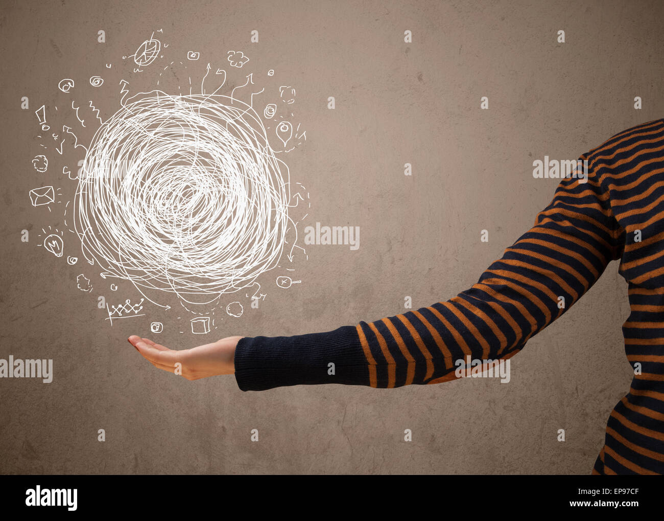 Chaos concept in the hand of a woman Stock Photo - Alamy