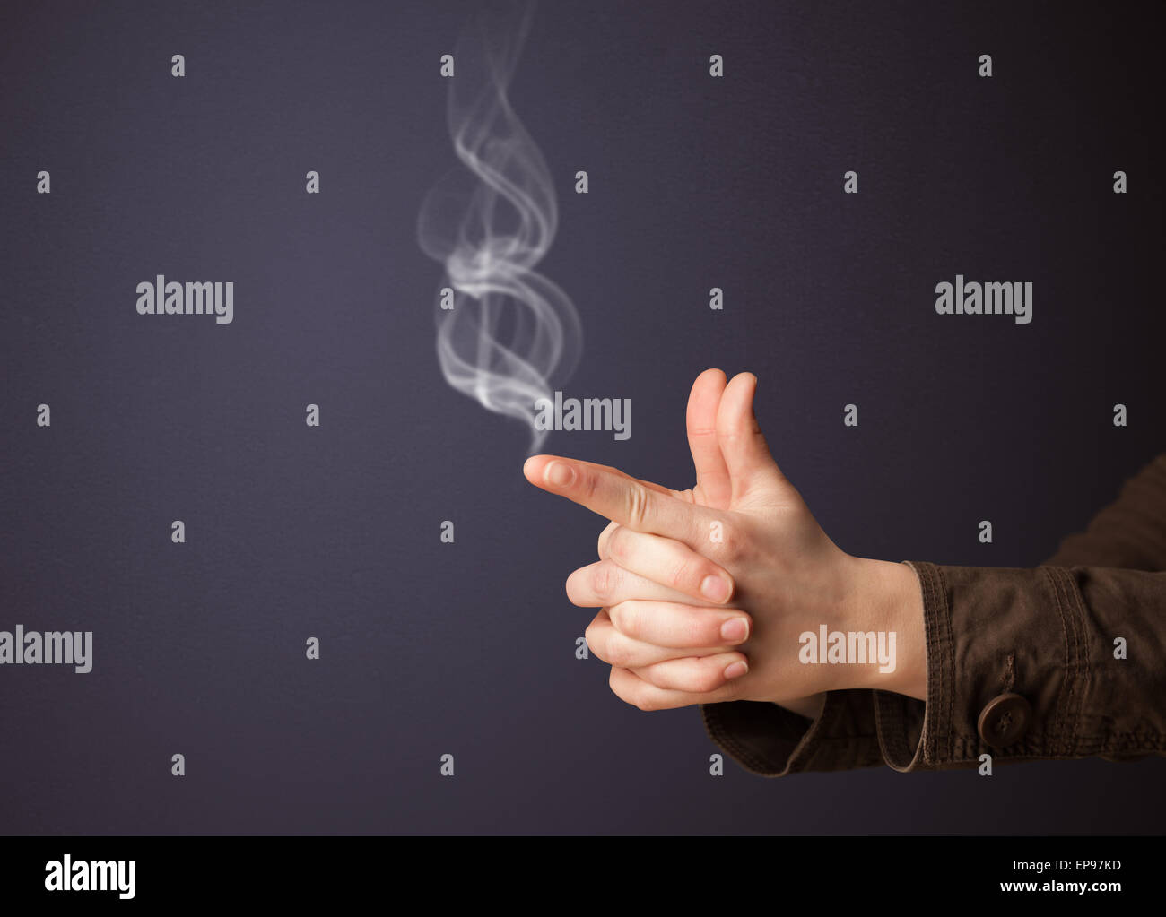 Gun shaped woman hand Stock Photo - Alamy