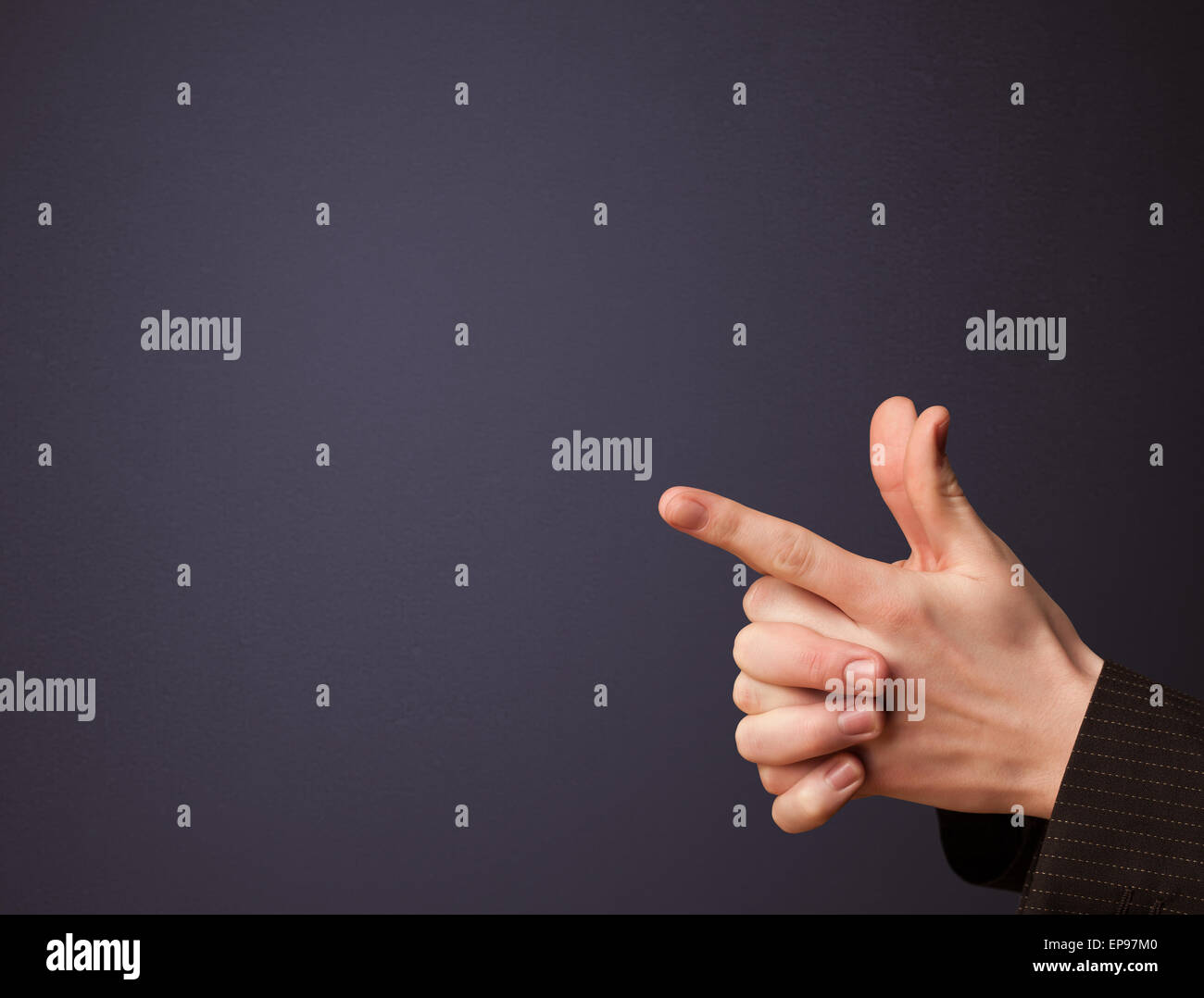 Gun shaped woman hand Stock Photo - Alamy