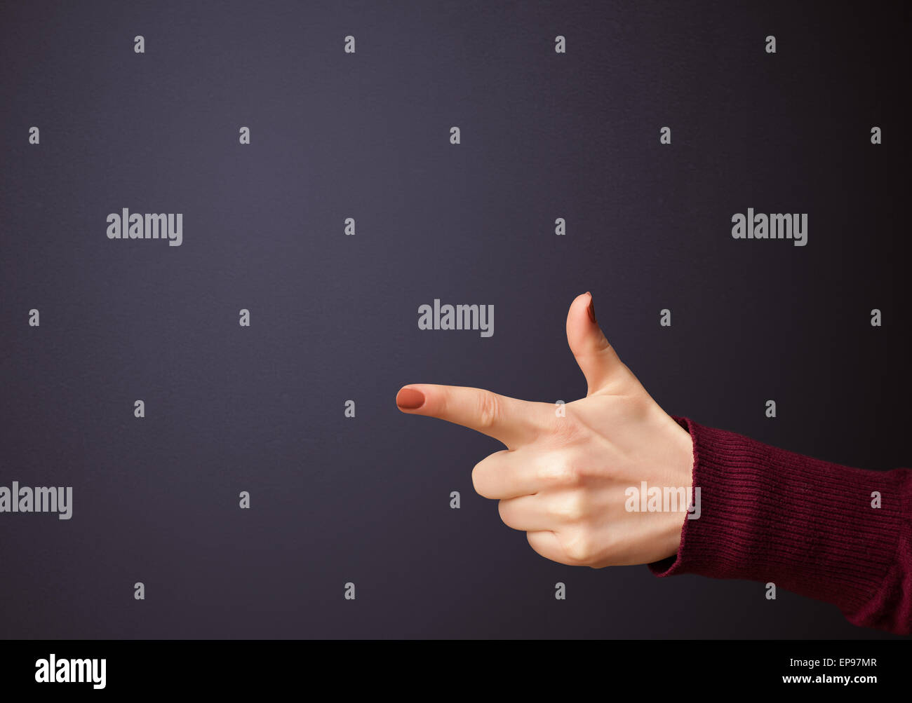 Gun shaped woman hand Stock Photo - Alamy