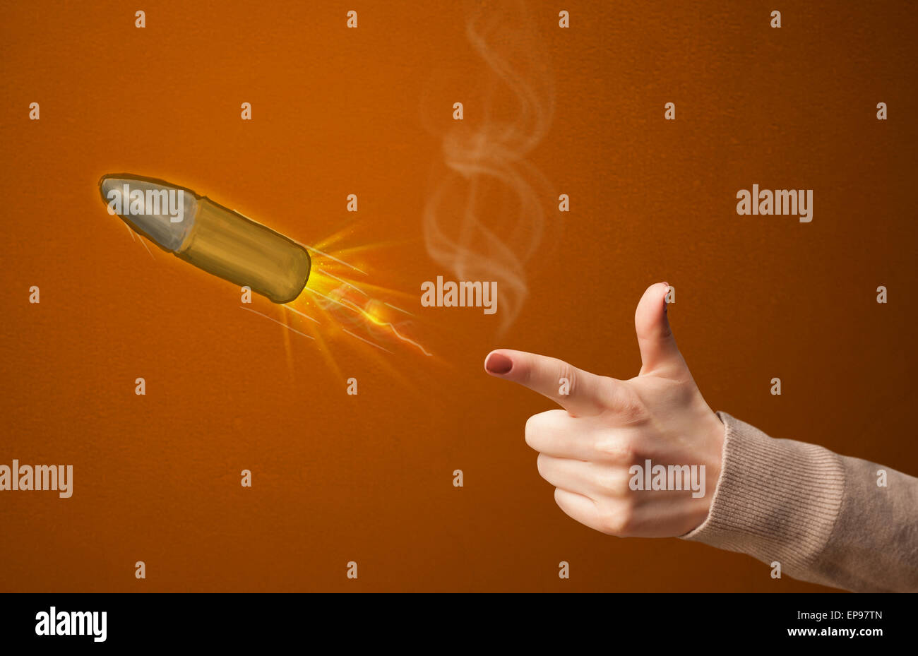 Gun shaped woman hand with bullet Stock Photo - Alamy