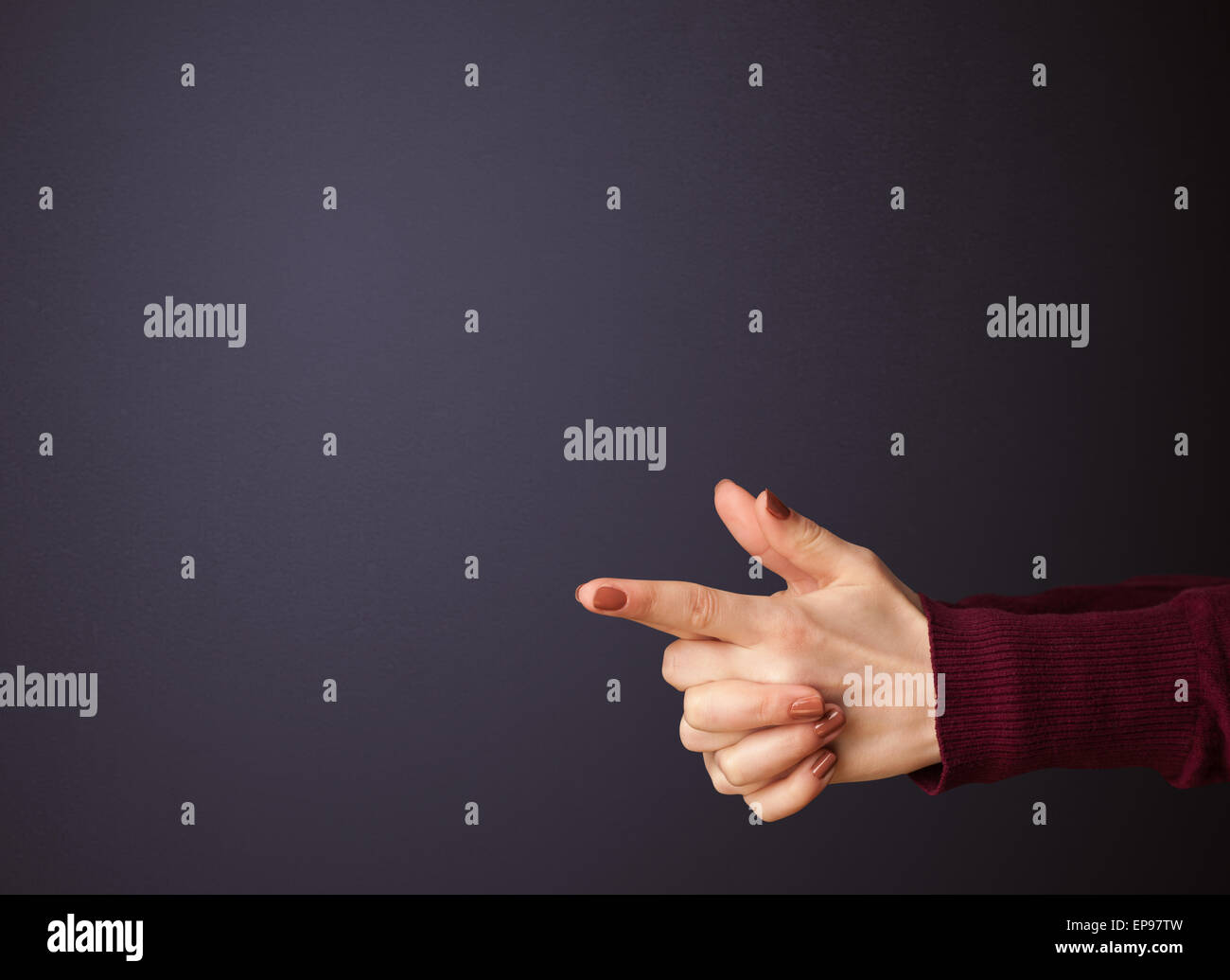 Gun shaped woman hand Stock Photo - Alamy